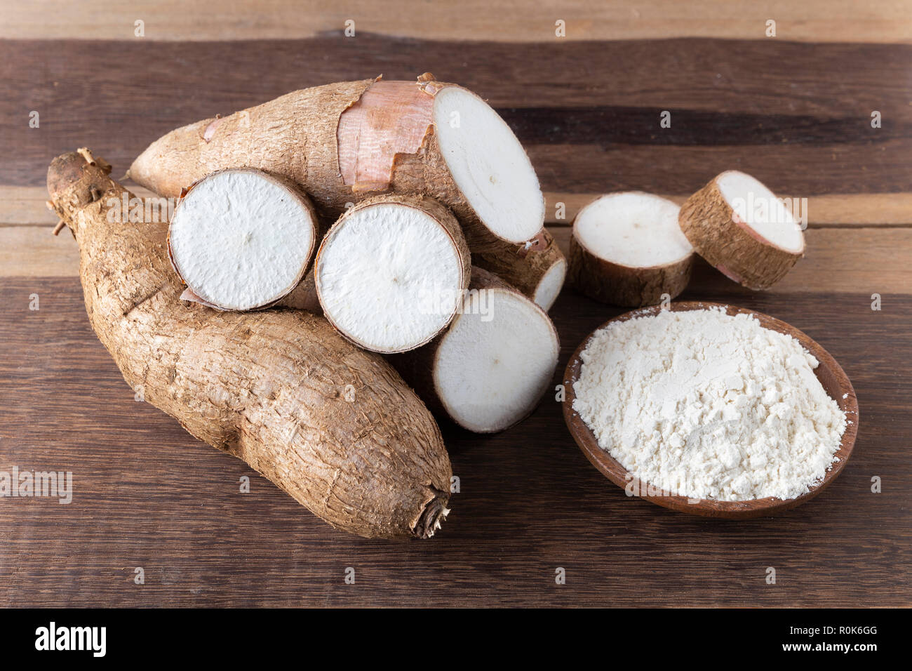 Raw yucca starch on the wooden table - Manihot esculenta Stock Photo ...