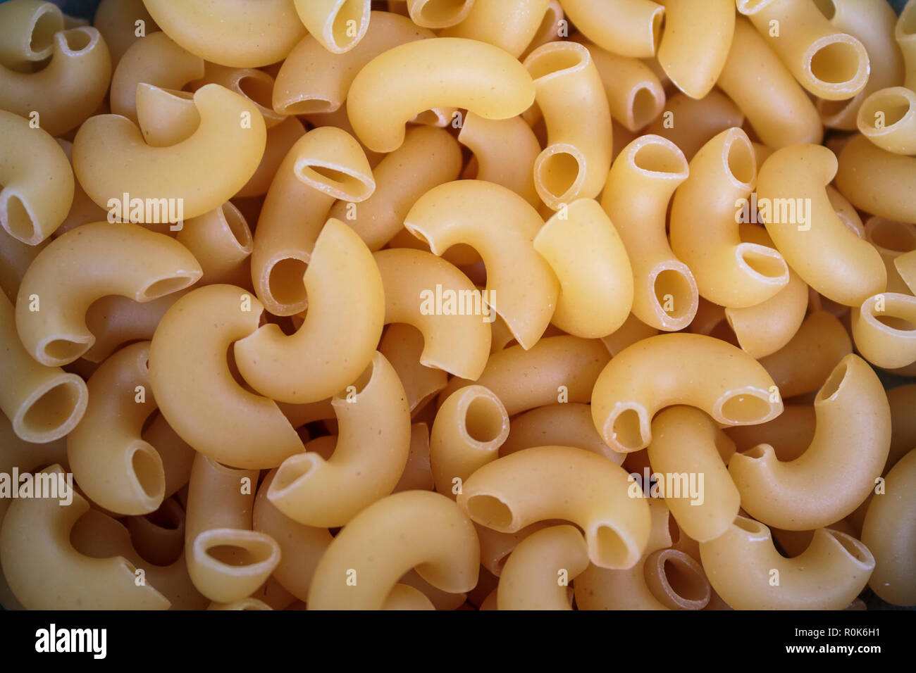 Macaroni elbows background Stock Photo - Alamy