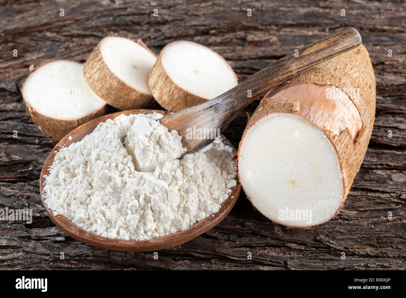 Raw yucca starch on the wooden table - Manihot esculenta Stock Photo ...