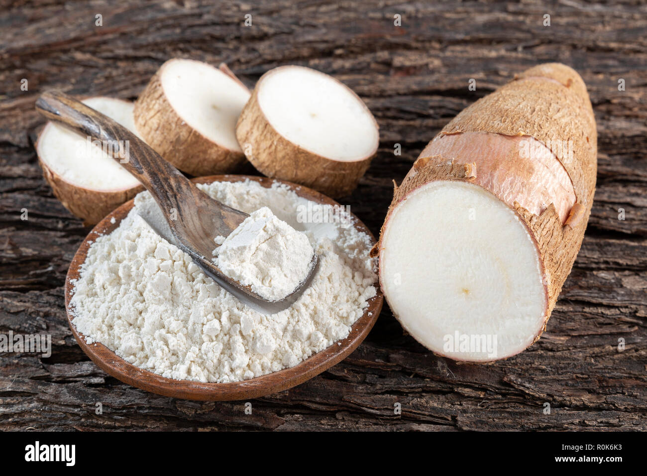 Raw yucca starch on the wooden table - Manihot esculenta Stock Photo ...