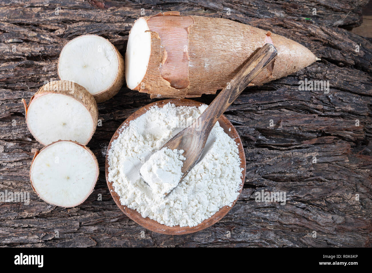 Raw yucca starch on the wooden table - Manihot esculenta Stock Photo ...