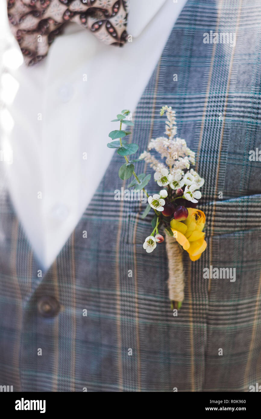 Bright groom boutonniere with yellow peony Stock Photo - Alamy