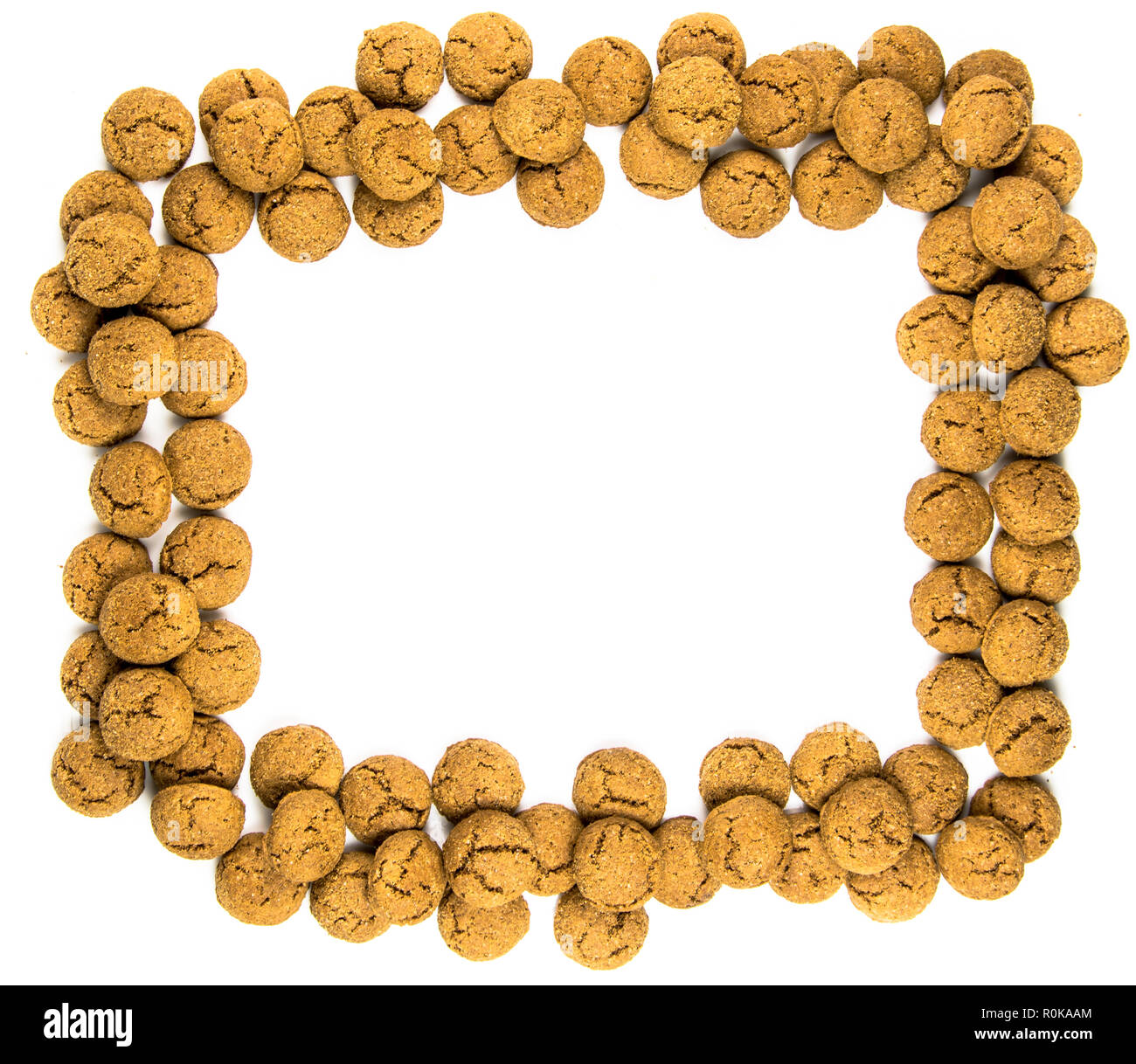 Frame of pepernoten from above on white background for annual ...