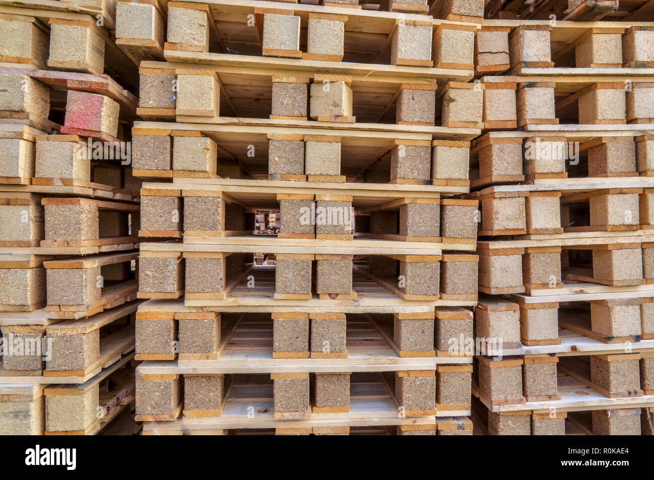Close up of Piles of different types of pallet at a recycling business ...