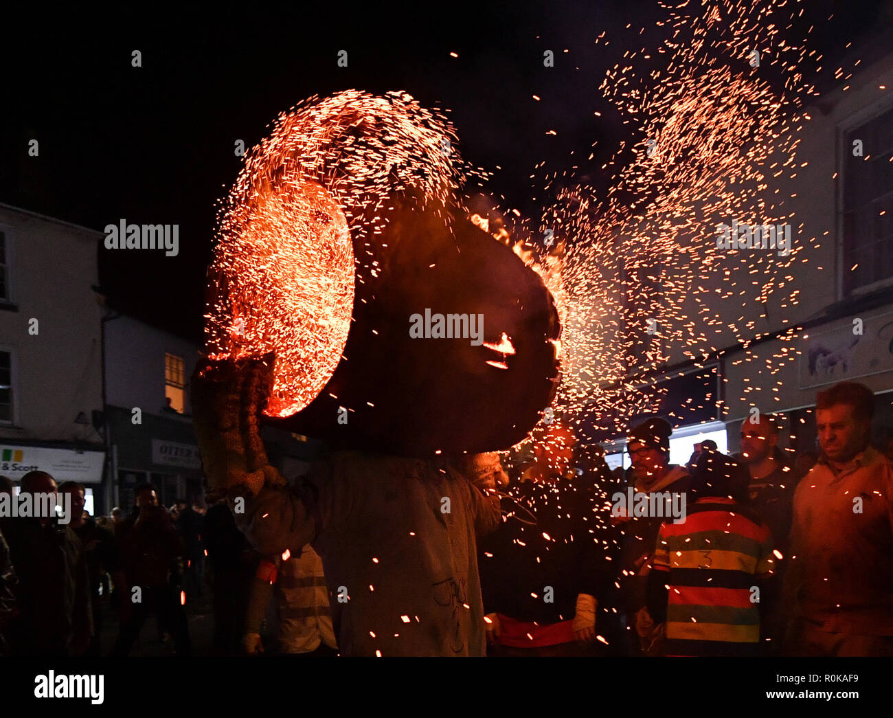 People from the village of Ottery St Mary in Devon carry the ...