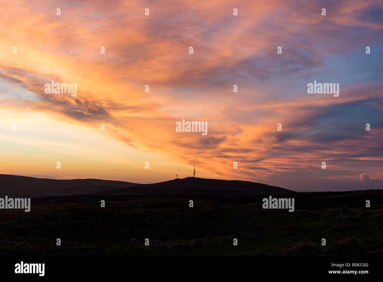 Dramatic sunset over silhouetted Belfast hills. Viewed from summit of ...