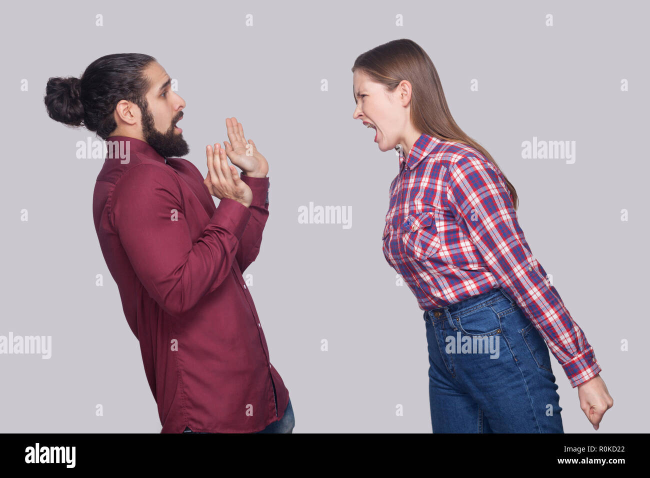 Profile side view portrait of angry woman standing and screaming at ...