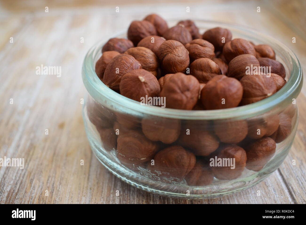 tree nuts in a glass jar isolated on white background Stock Photo - Alamy