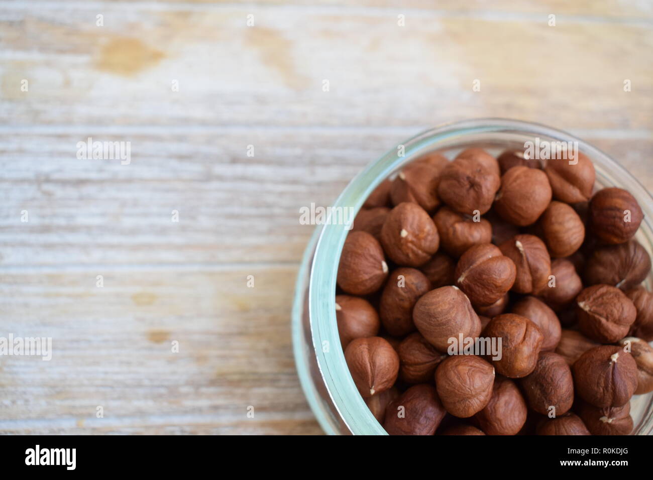 tree nuts in a glass jar isolated on white background Stock Photo - Alamy
