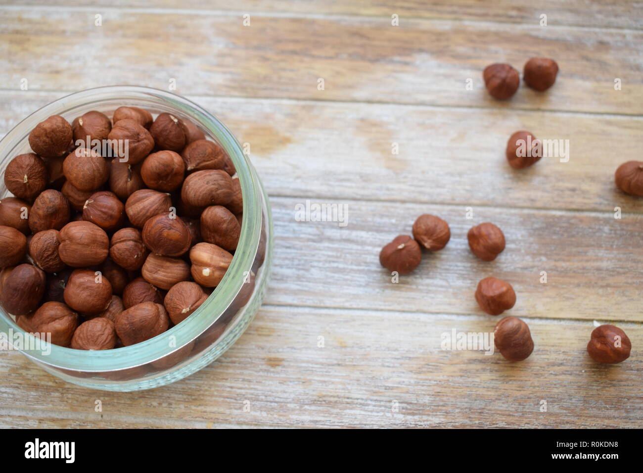 tree nuts in a glass jar isolated on white background Stock Photo - Alamy