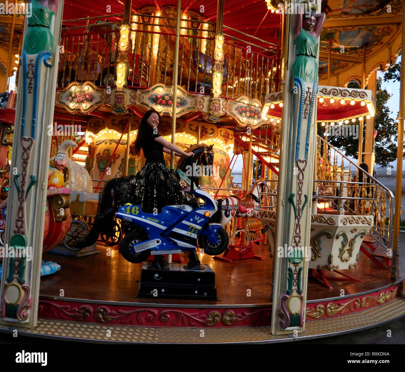 Woman riding carousel horse hi-res stock photography and images - Alamy