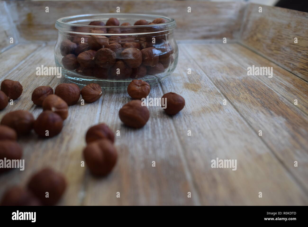 tree nuts in a glass jar isolated on white background Stock Photo - Alamy