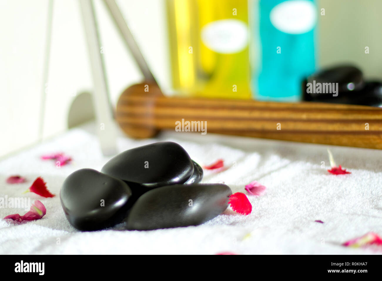 Hot rocks and flower petals in the Indaba Spa Stock Photo - Alamy
