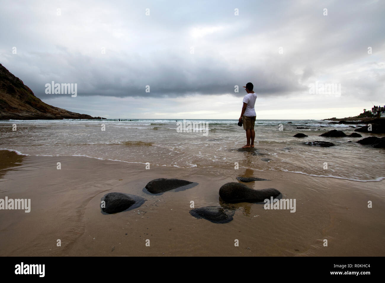 Man looking out into the ocean hi-res stock photography and images - Alamy