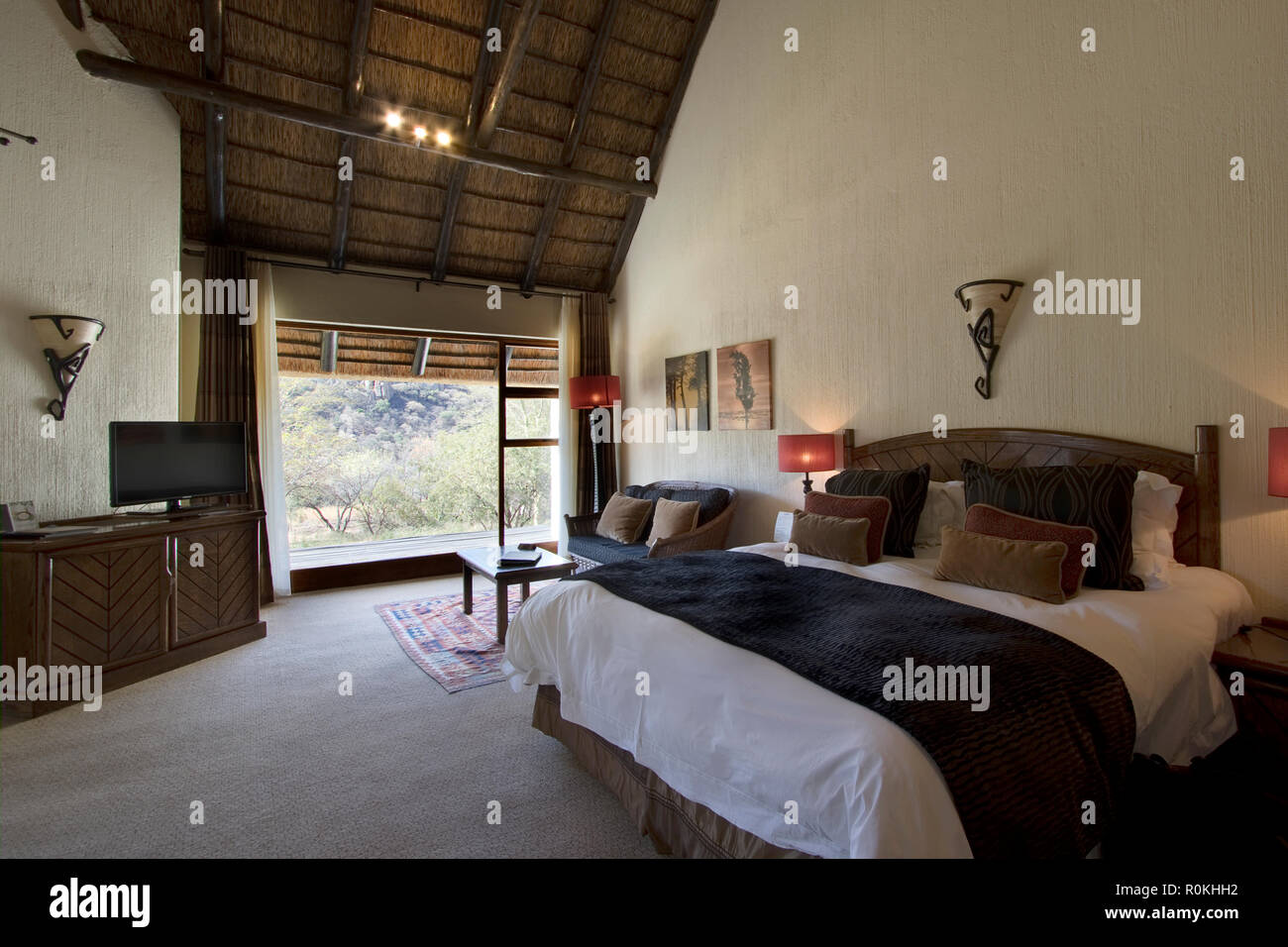 Bedroom in Kwa Maritane Lodge Stock Photo - Alamy