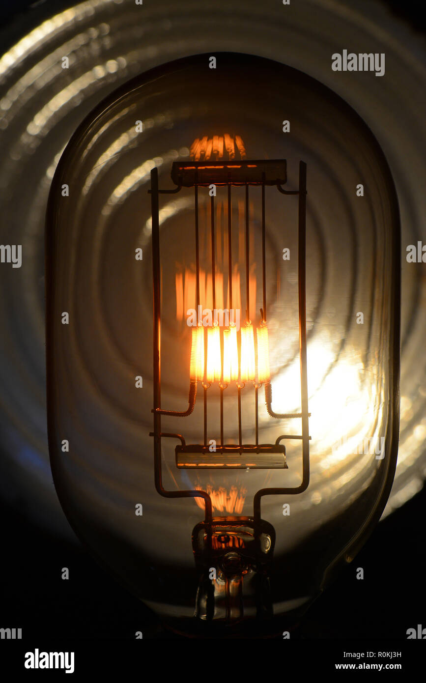 close up lightbulb filament glowing when switched on Stock Photo - Alamy