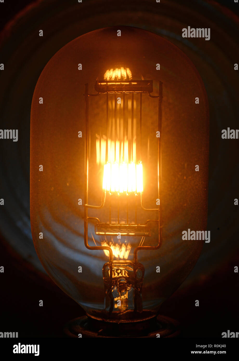 close up lightbulb filament glowing when switched on Stock Photo - Alamy