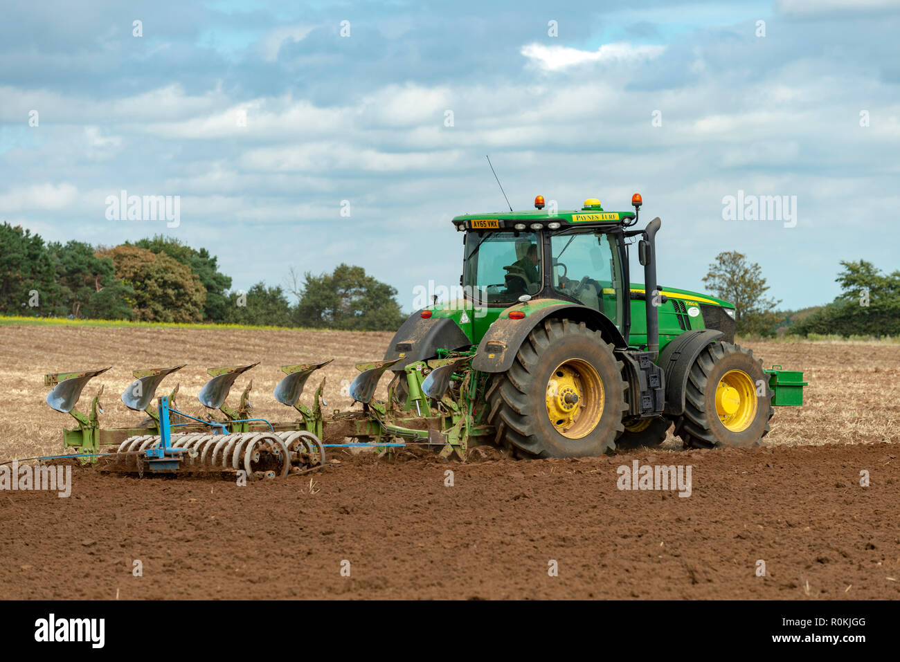 John Deere tractor and plough, Bawdsey, Suffolk, England Stock Photo ...