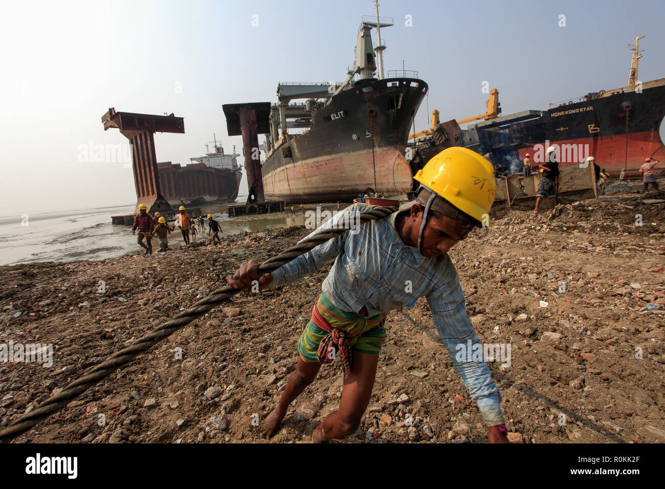 Labourers work at ship- breaking yard. Bangladesh is dependent on ship ...