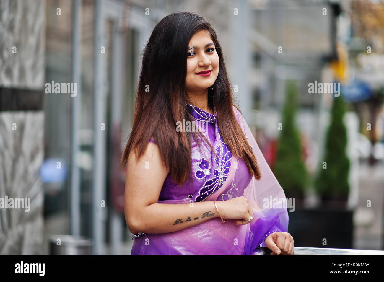 Indian hindu girl at traditional violet saree posed at street Stock ...