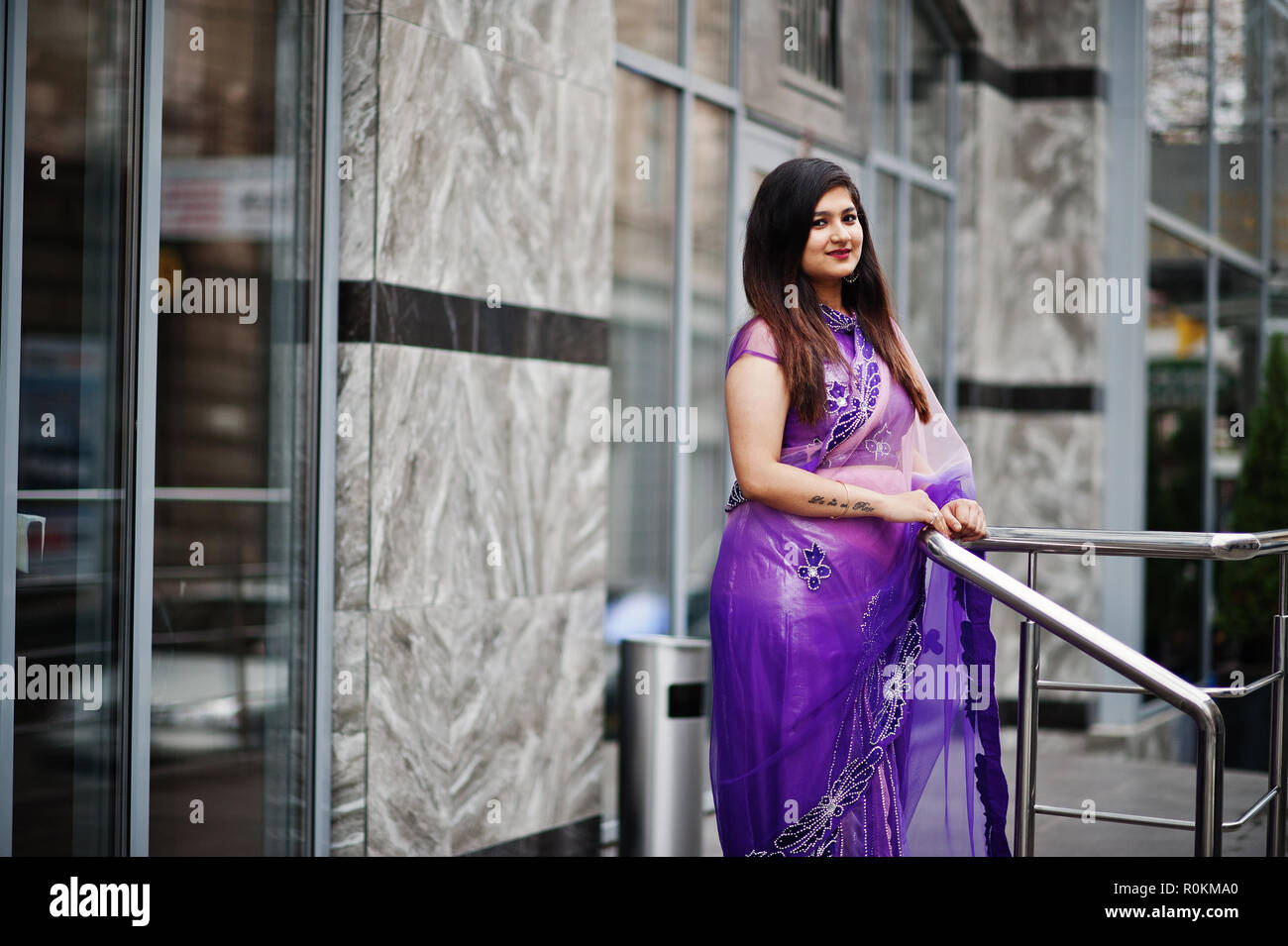 Indian hindu girl at traditional violet saree posed at street Stock ...
