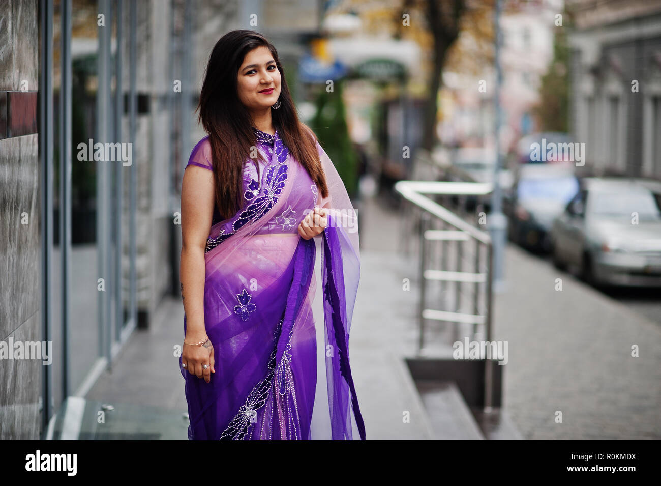 Indian hindu girl at traditional violet saree posed at street Stock ...