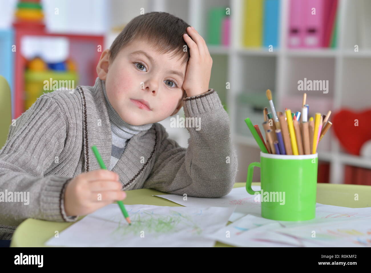 Portrait of a little boy drawing with pencil Stock Photo - Alamy