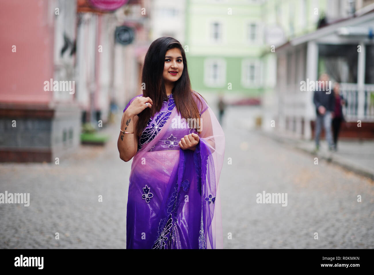 Indian hindu girl at traditional violet saree posed at street Stock ...