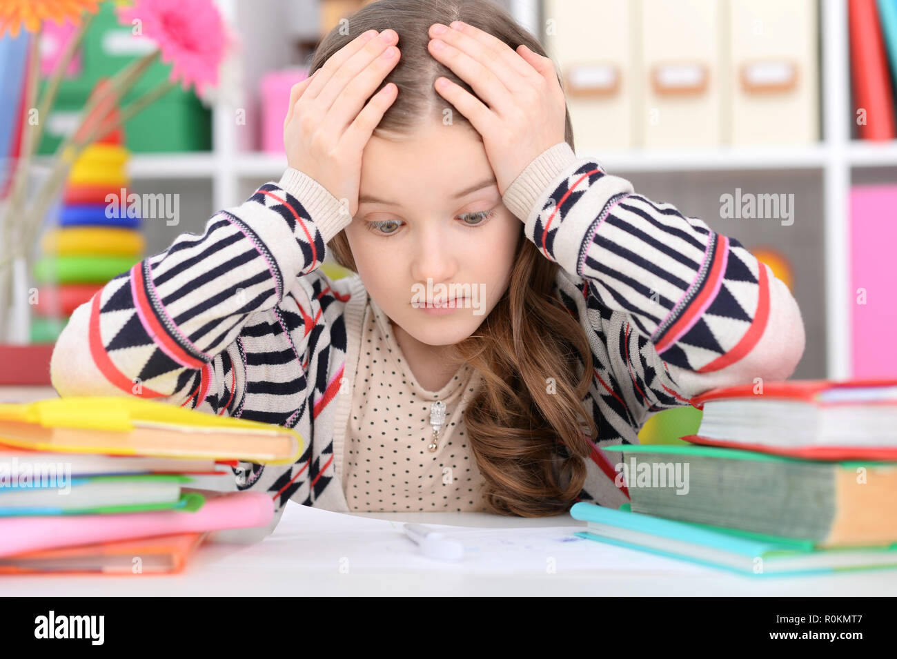 Portrait of a cute little girl doing homework Stock Photo - Alamy