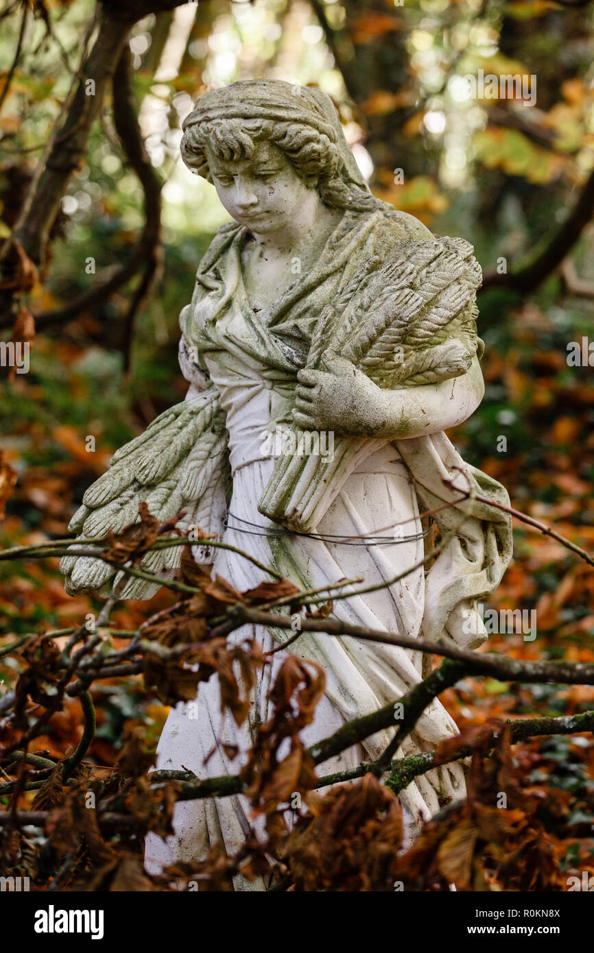 Sculpture of a woman carrying sheaf of wheat symbolizing harvest and ...