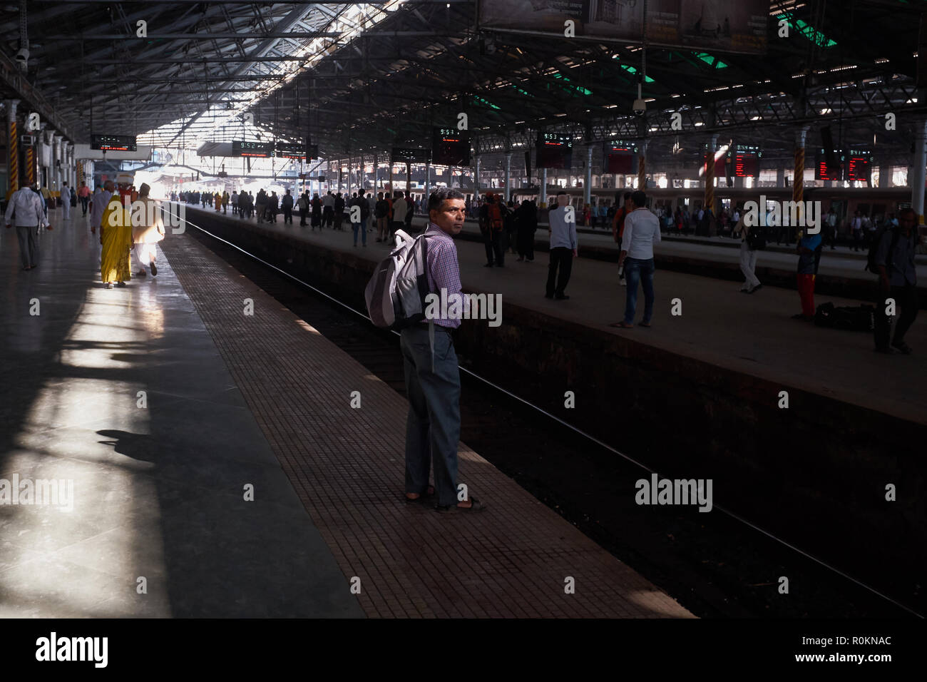 A lone passenger stands on a platform in Chhatrapati Shivaji Maharaj ...
