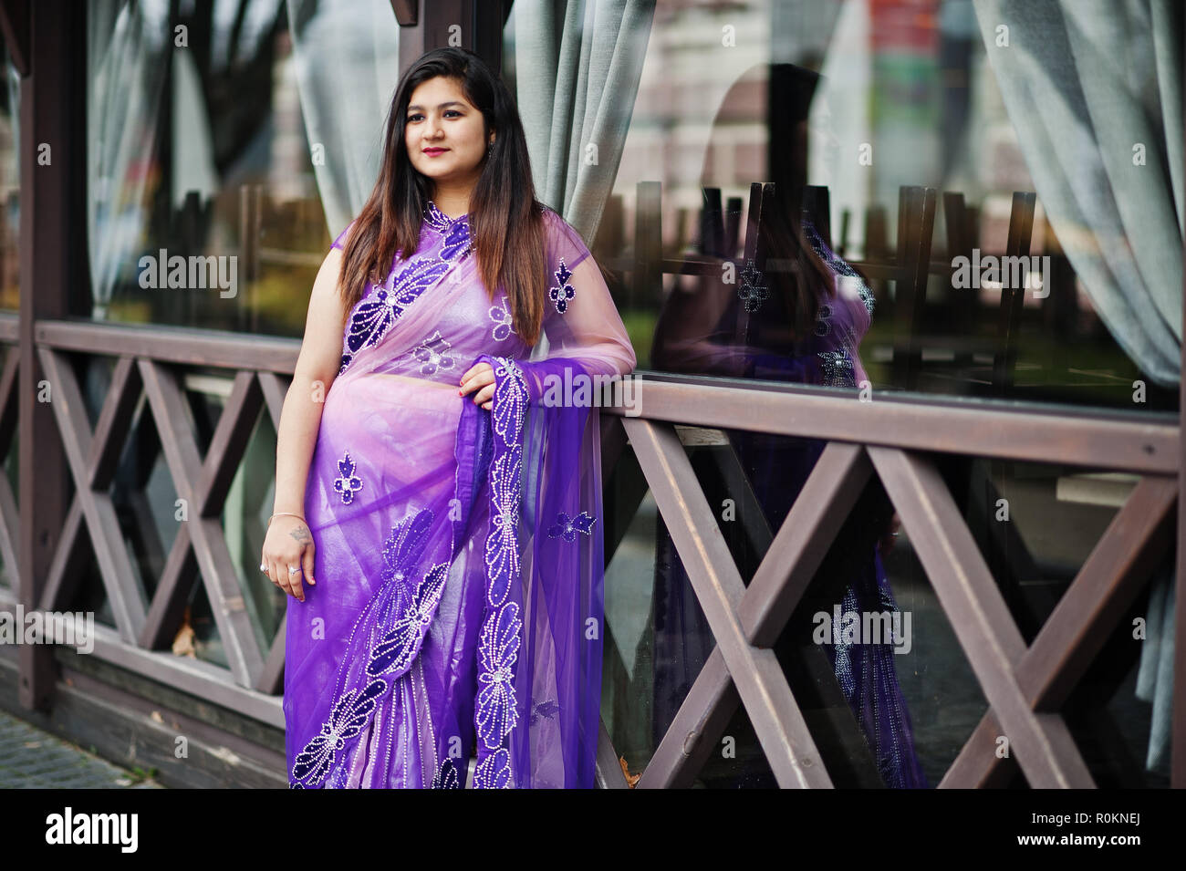 Indian hindu girl at traditional violet saree posed at street Stock ...