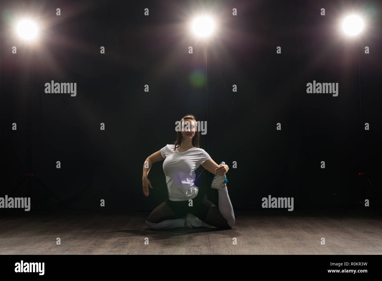 People and dancing concept - Pretty woman dancing jazz funk over dark ...