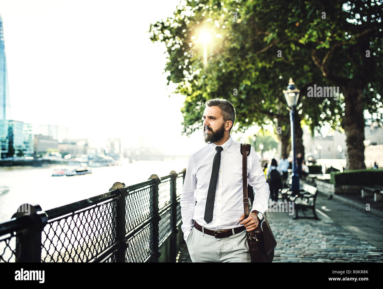 Professional man walking laptop computer hi-res stock photography and ...