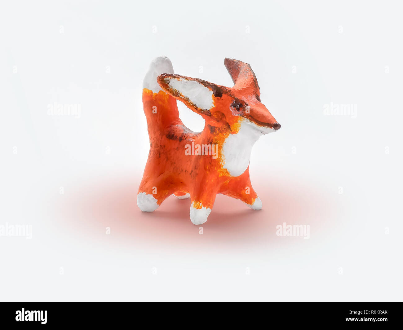 Orange and red ceramic fox, sculpture, isolated white background Stock ...