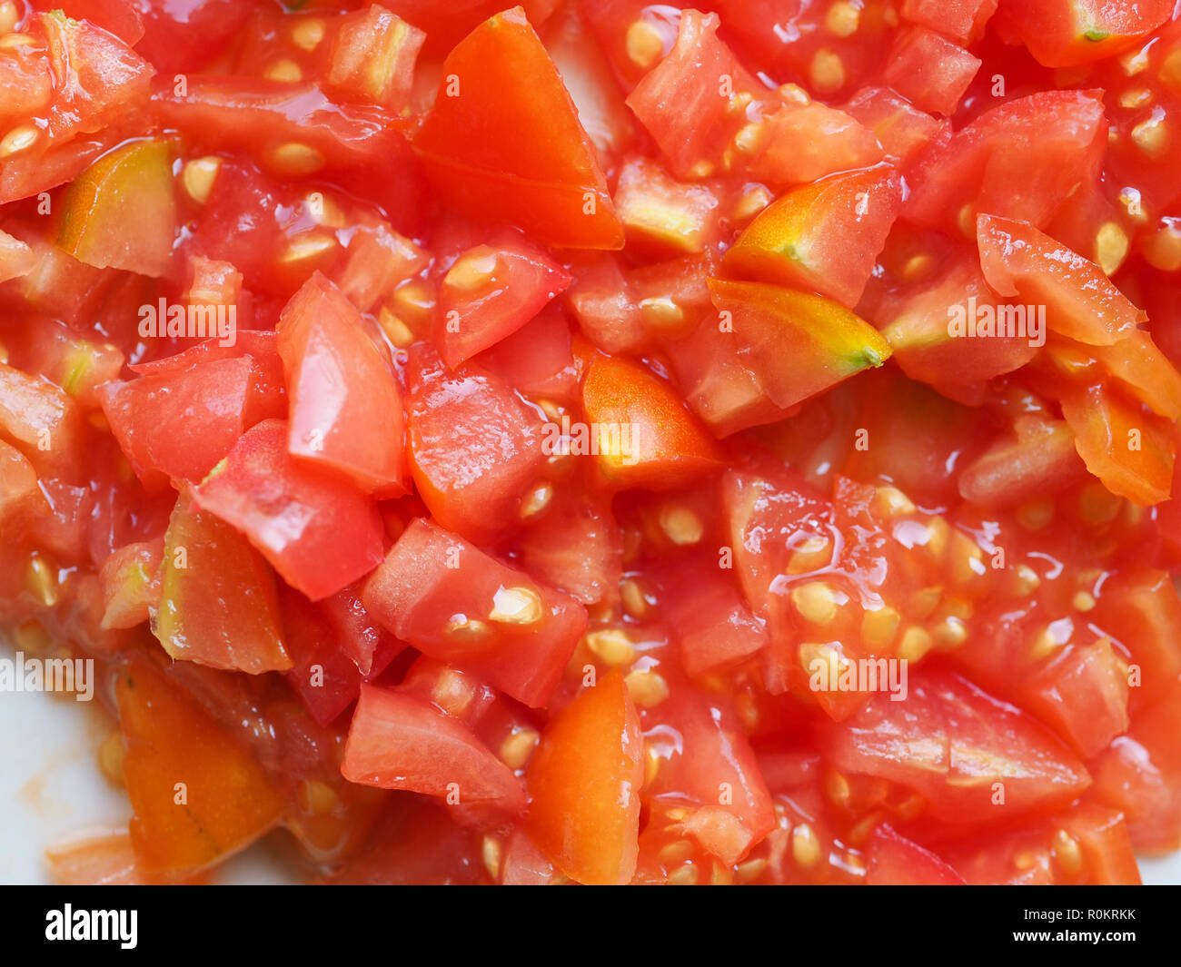 chopped tomato preparation for pizza vegetarian food Stock Photo - Alamy