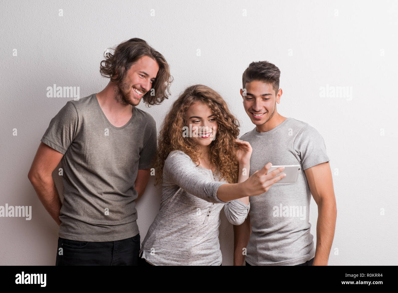 Young trendy group portrait studio hi-res stock photography and images ...
