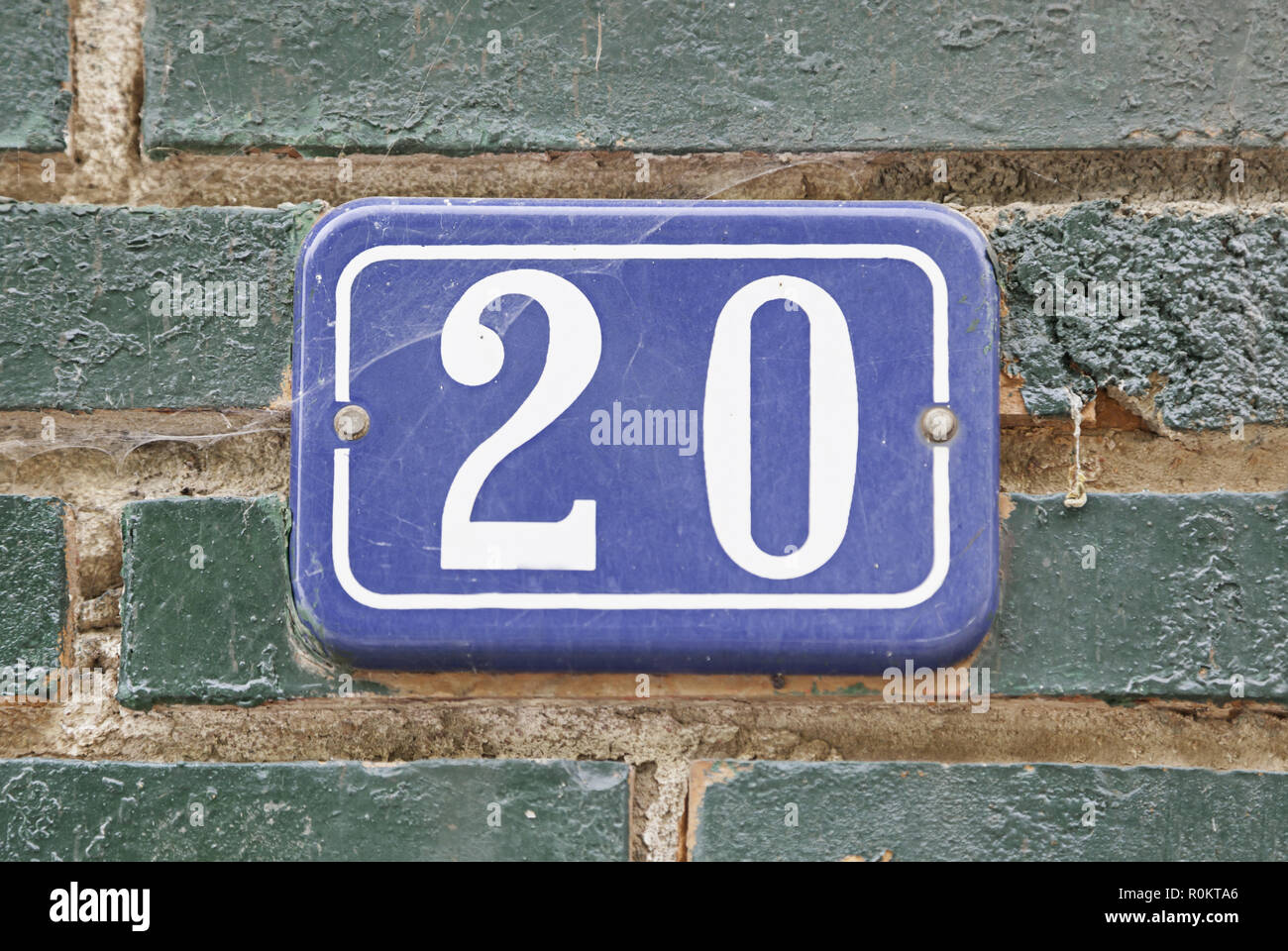 Plate with number twenty, detail of a data plate with a figure of ...