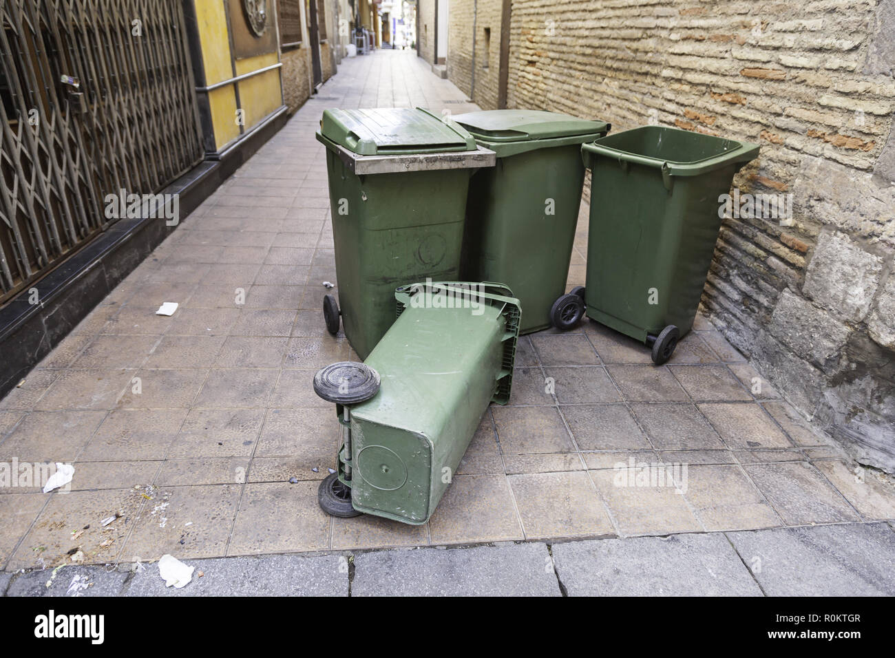 Garbage containers lying in the street, garbage detail lying in the ...