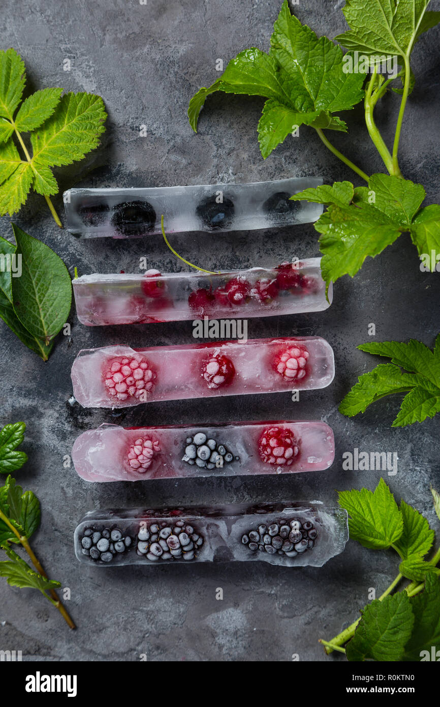 Frozen berries in ice cubes Stock Photo - Alamy