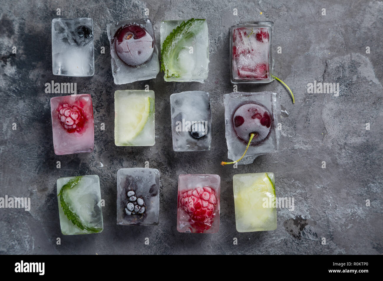 Frozen berries in ice cubes Stock Photo - Alamy