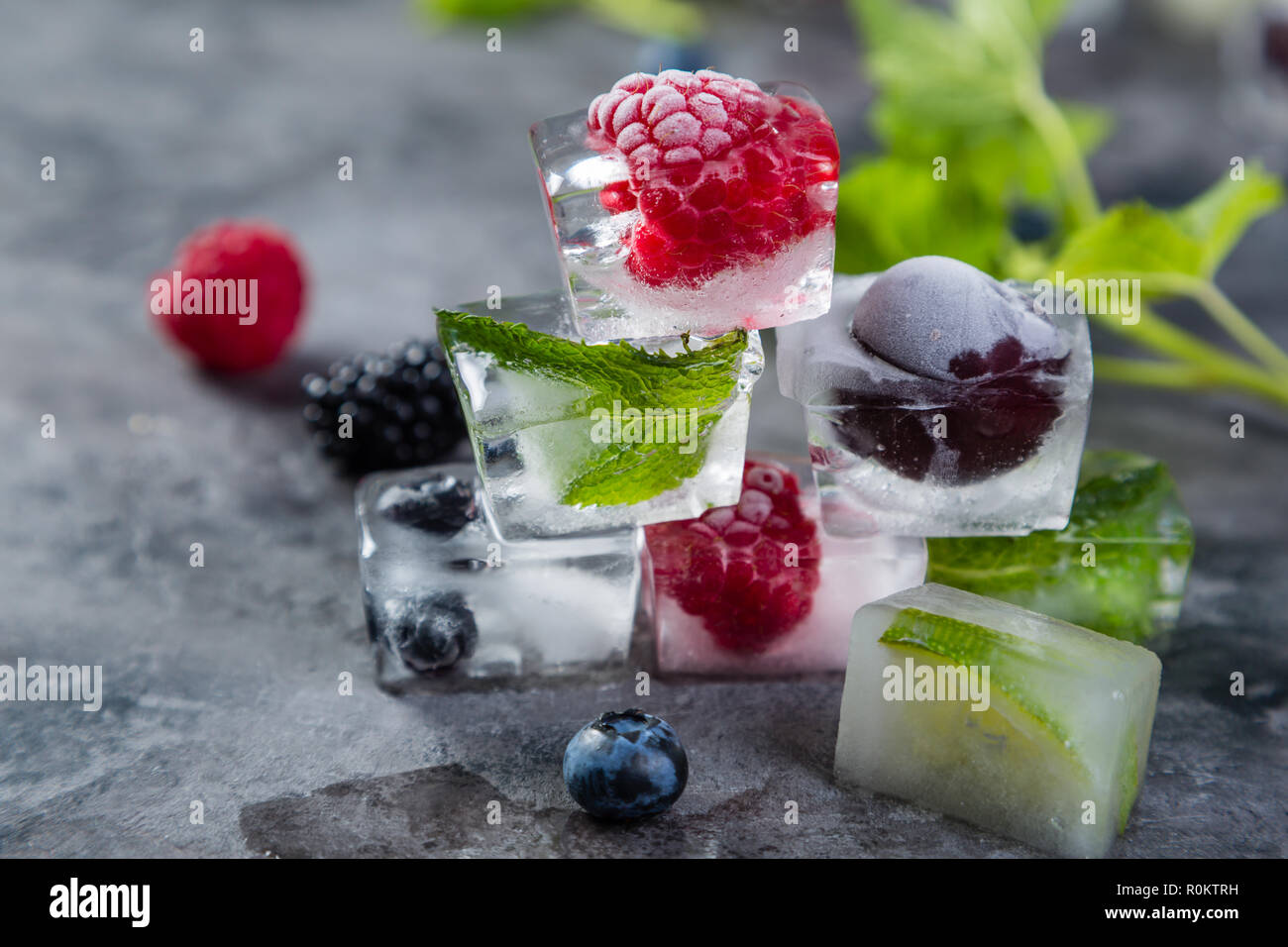 Frozen berries in ice cubes Stock Photo - Alamy