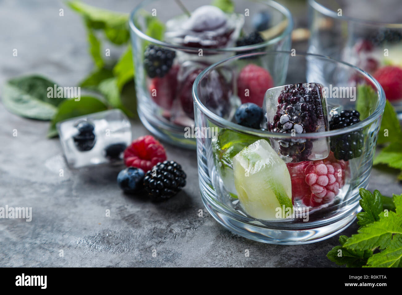 Frozen berries in ice cubes Stock Photo - Alamy