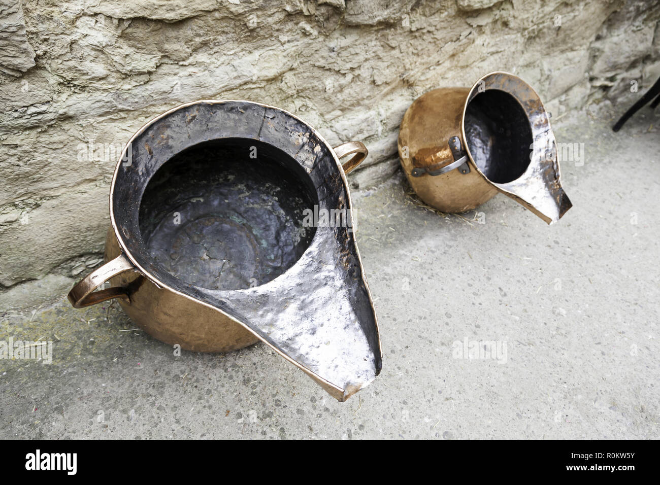 Antique copper vessels, detail of a couple of metal objects, old and ...
