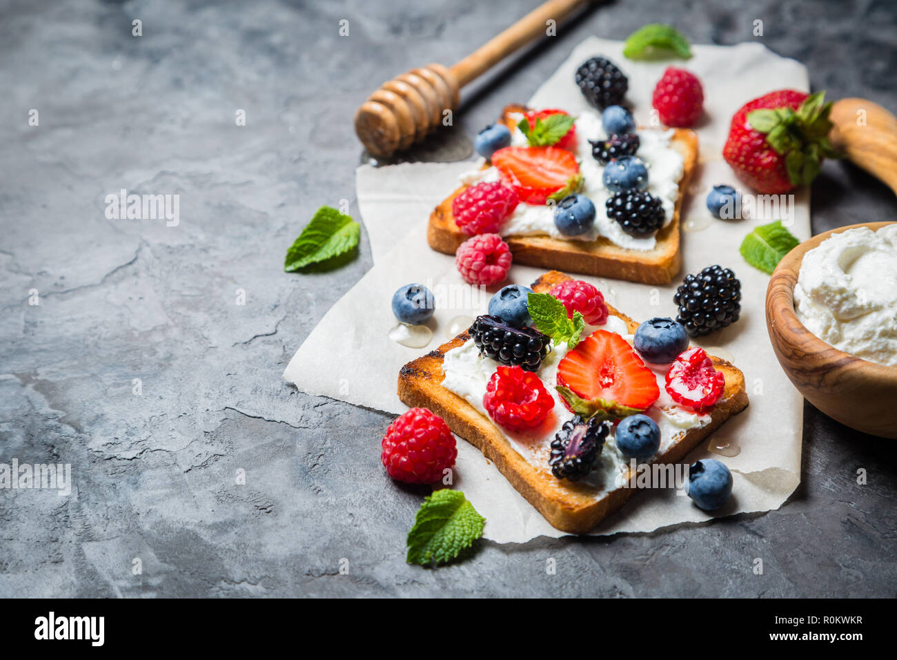 Selection of toasts with cheese peanut butter and berries Stock Photo ...
