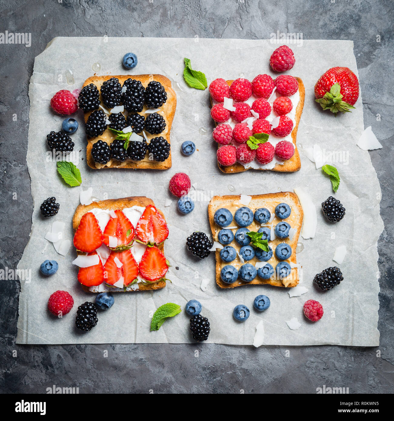 Selection of toasts with cheese peanut butter and berries Stock Photo ...