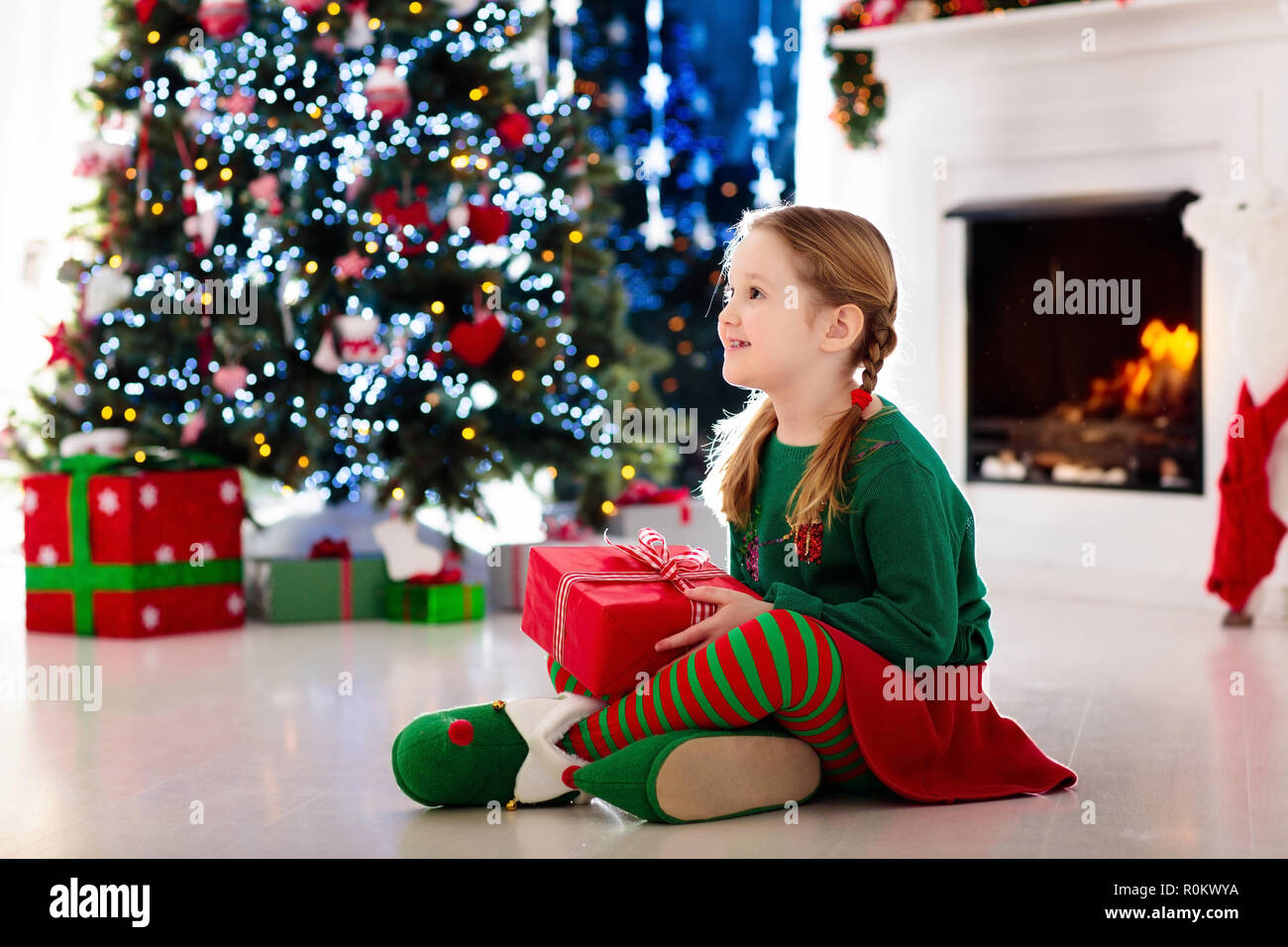 Child opening present hi-res stock photography and images - Alamy