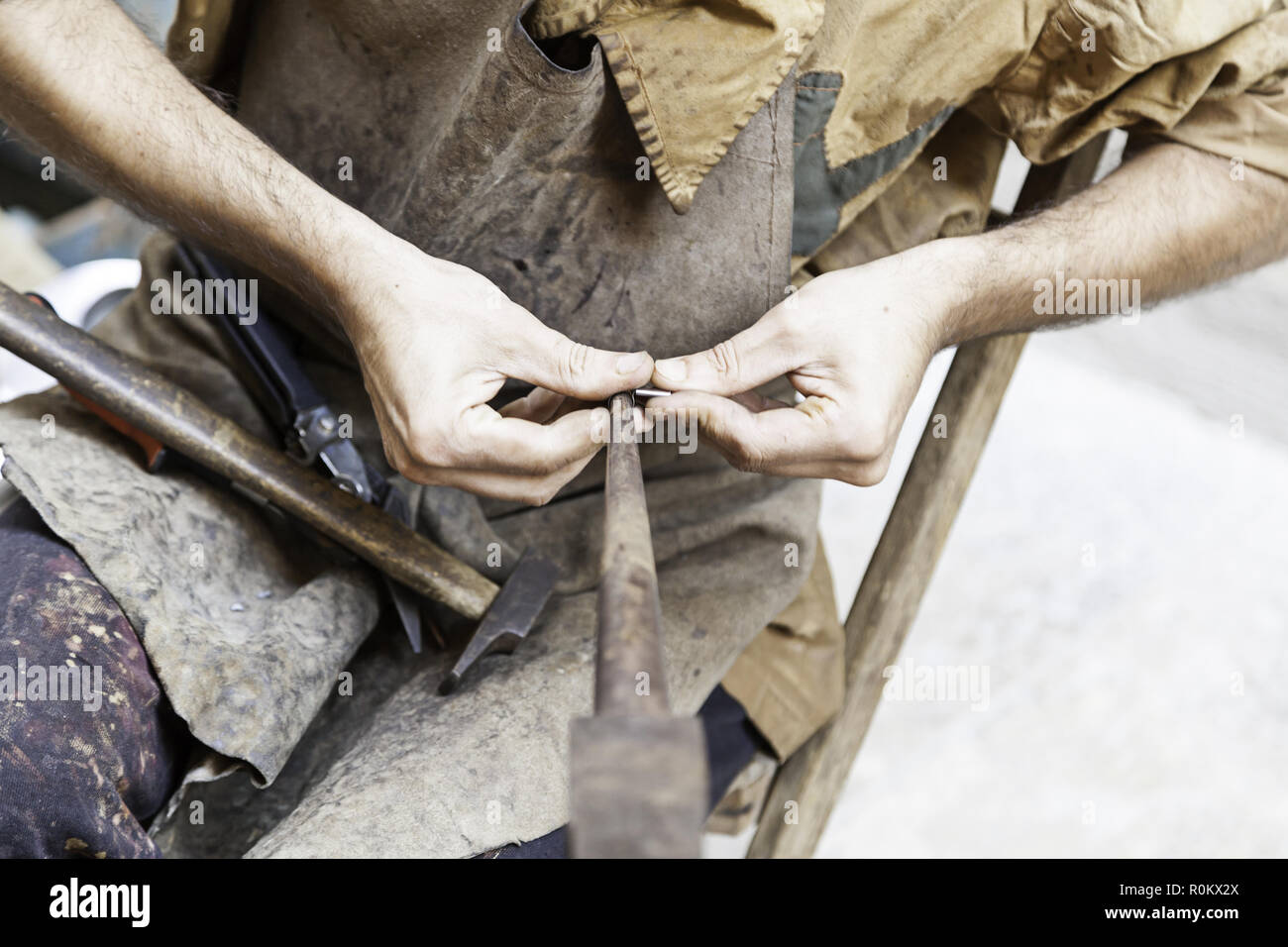 Worker metal craftsman, an artisan detail, tradition and old work Stock ...