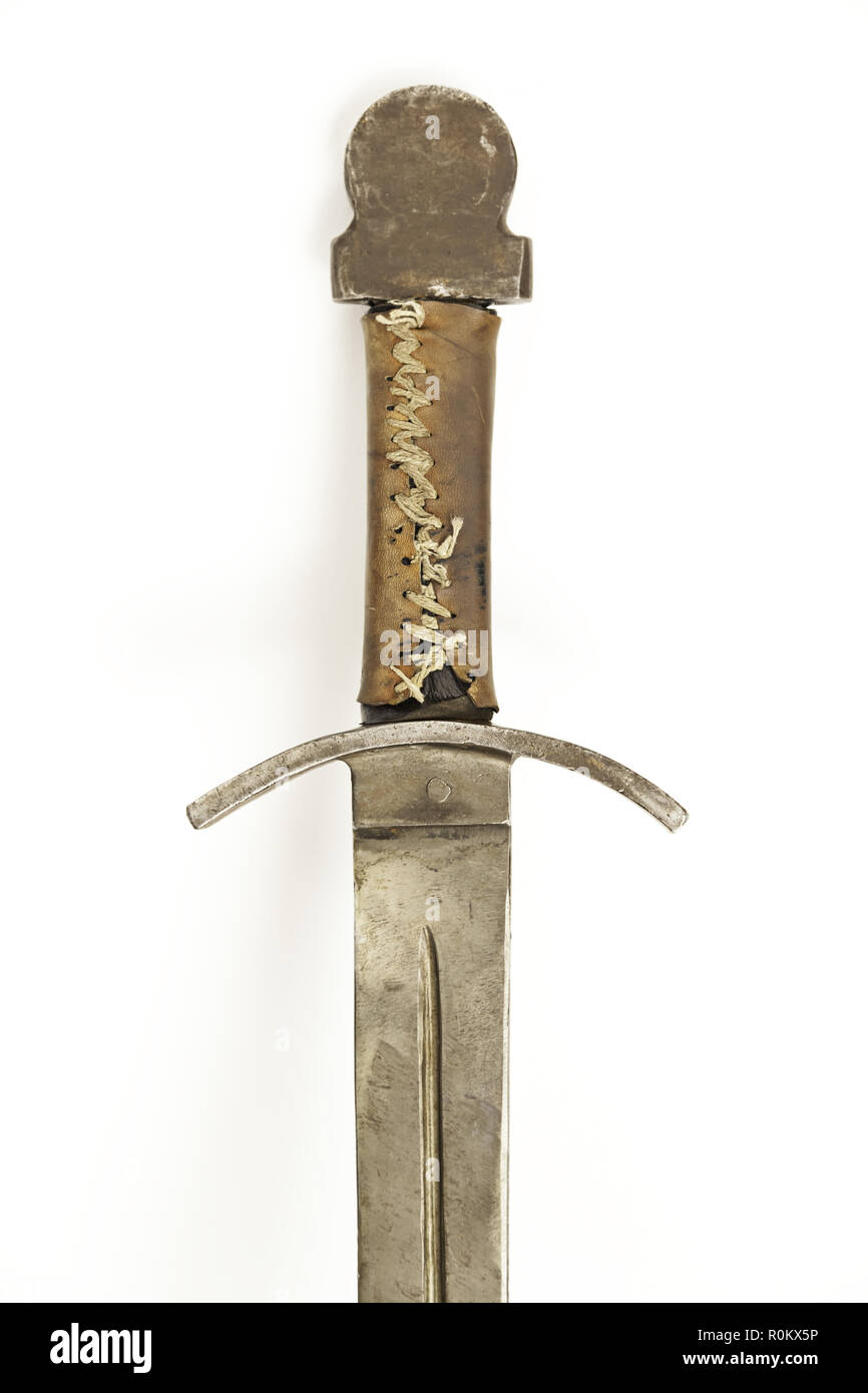 Old medieval sword, detail of a handle of a weapon of war and death ...