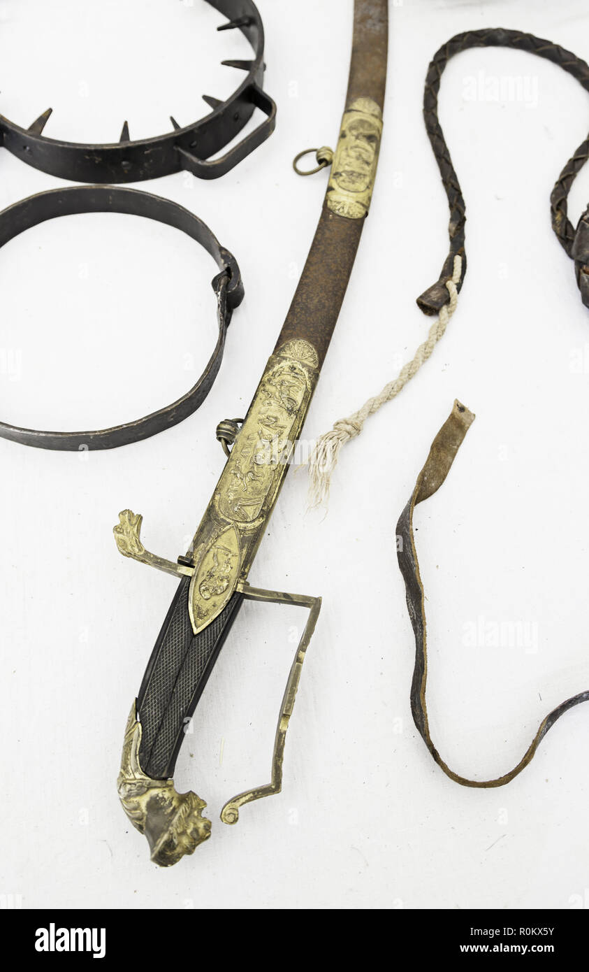 Sword and instruments of torture, detail of antique weapons, medieval ...